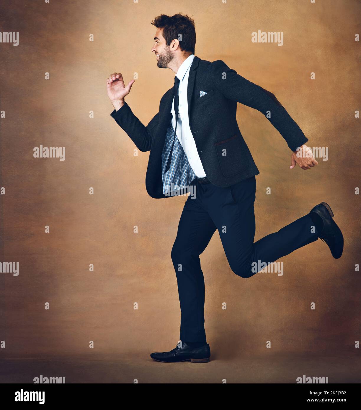 Young happy man running suit hi-res stock photography and images - Alamy
