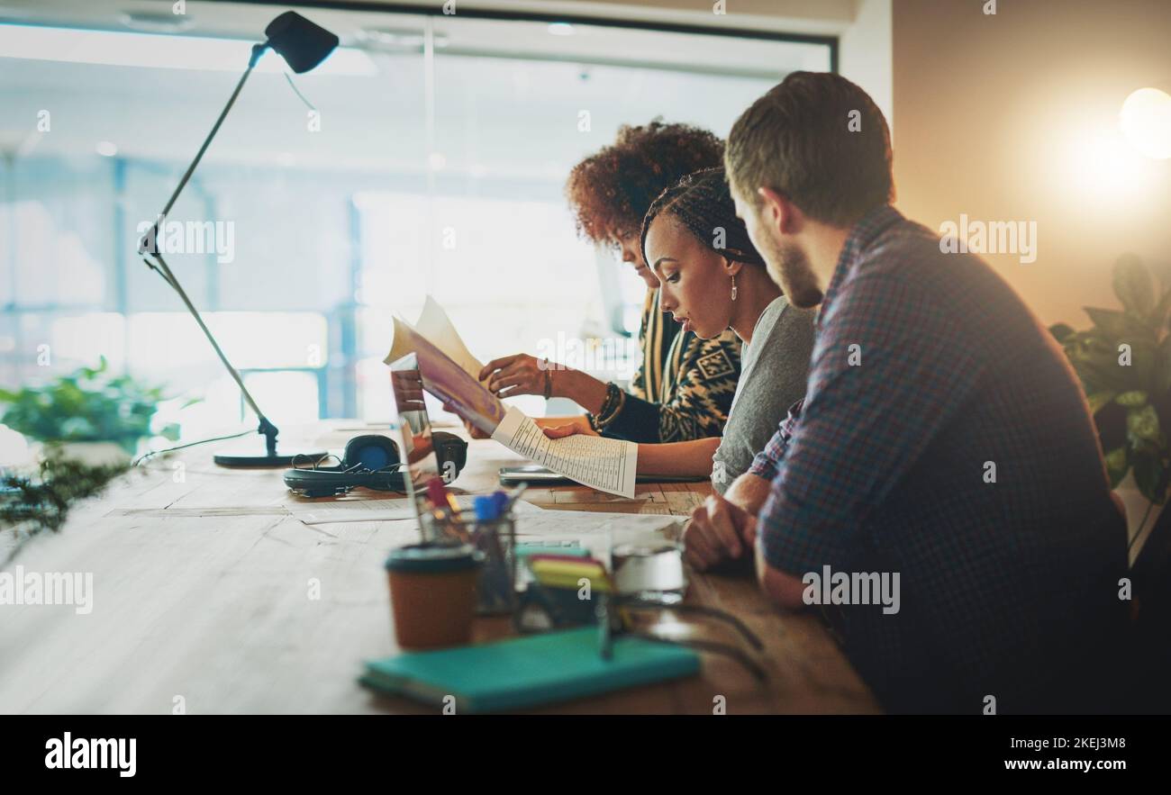 Success is a combined effort. a group of colleagues working on a ...