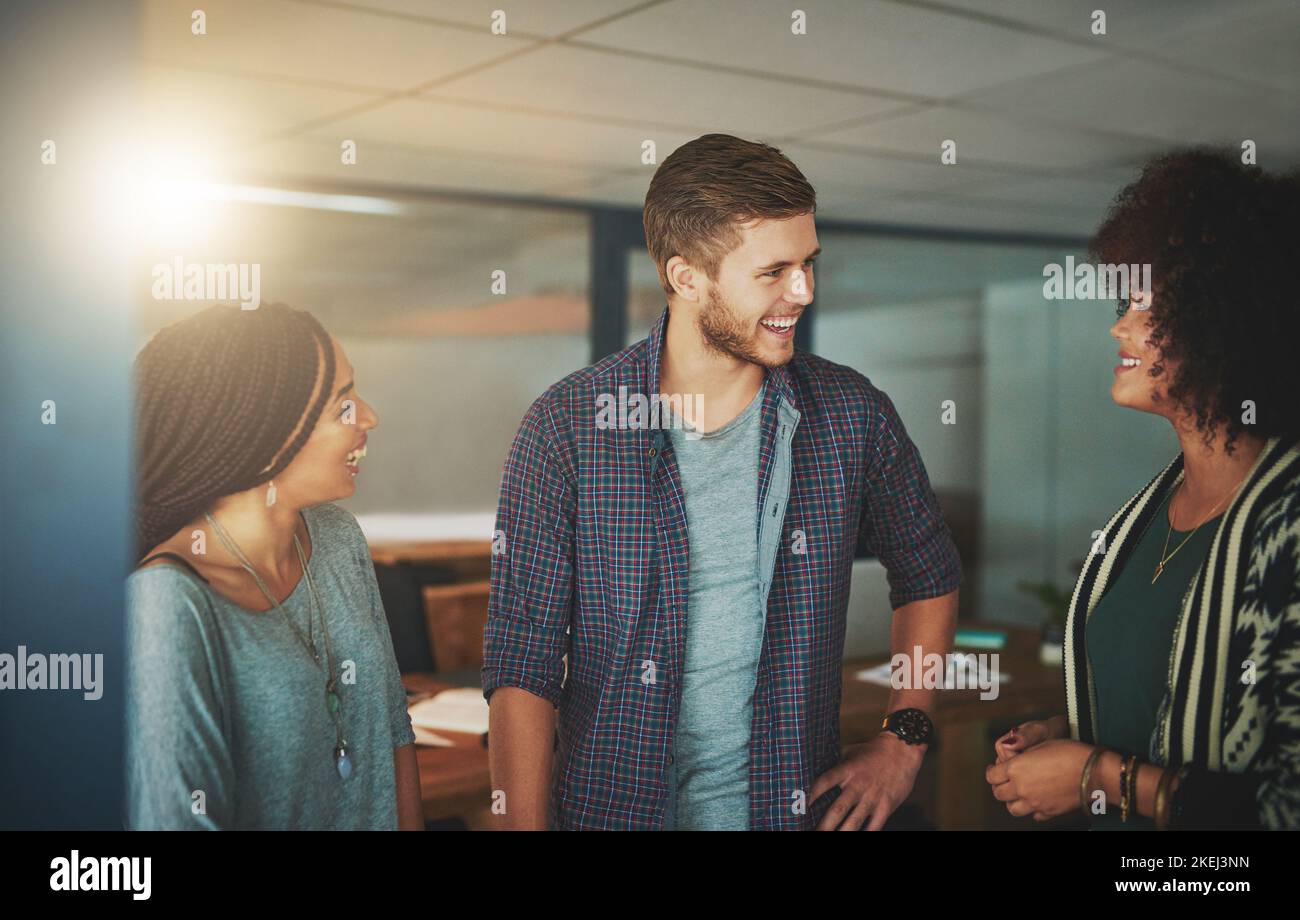 Their ability to communicate makes them successful. colleagues talking ...