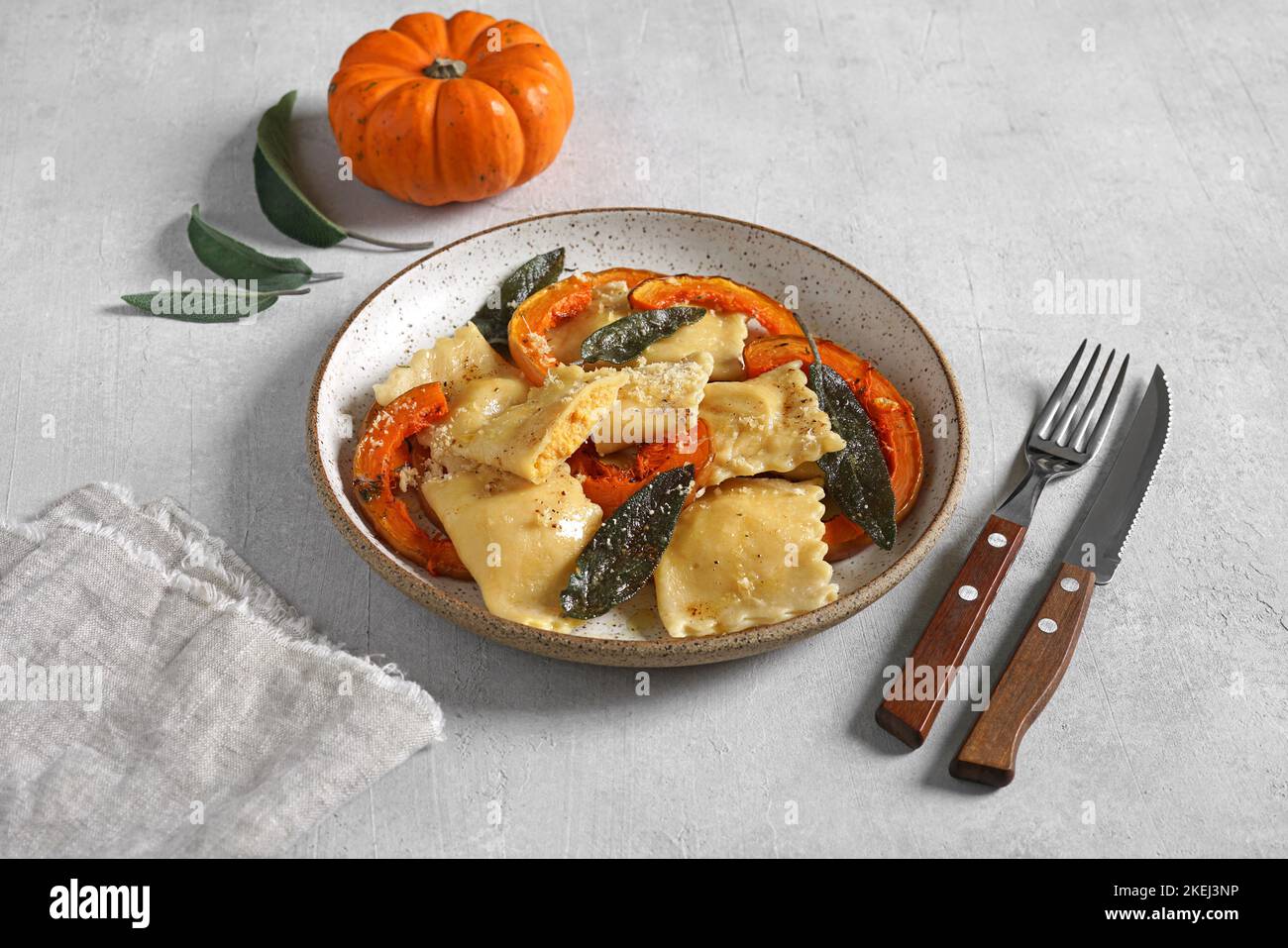 Homemade Pumpkin Ravioli with ricotta cheese served sage butter and ...