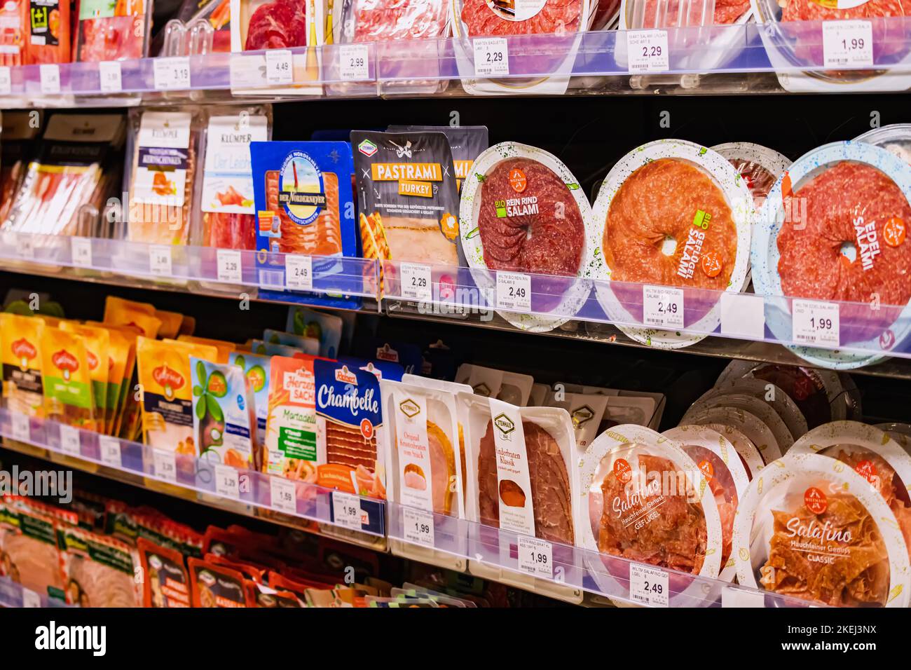 26 July 2022, Munster, Germany: sausage and sliced salami in vacuum ...