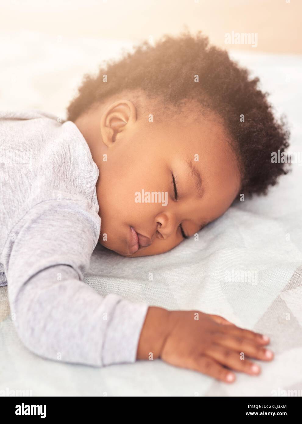 Sleep sweetly precious one. a little baby boy sleeping on a bed Stock ...