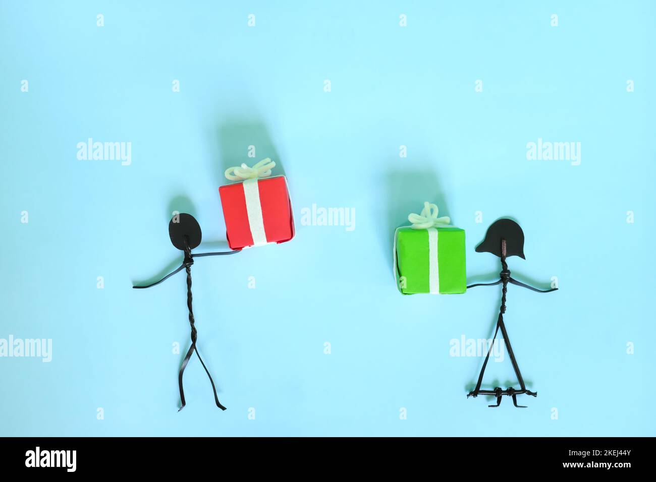 Christmas season or anniversary gift giving and sharing concept. Man ...