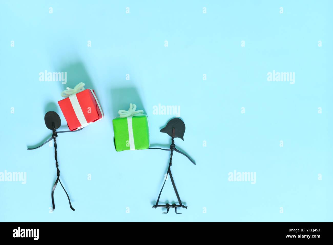 Christmas season or anniversary gift giving and sharing concept. Man ...