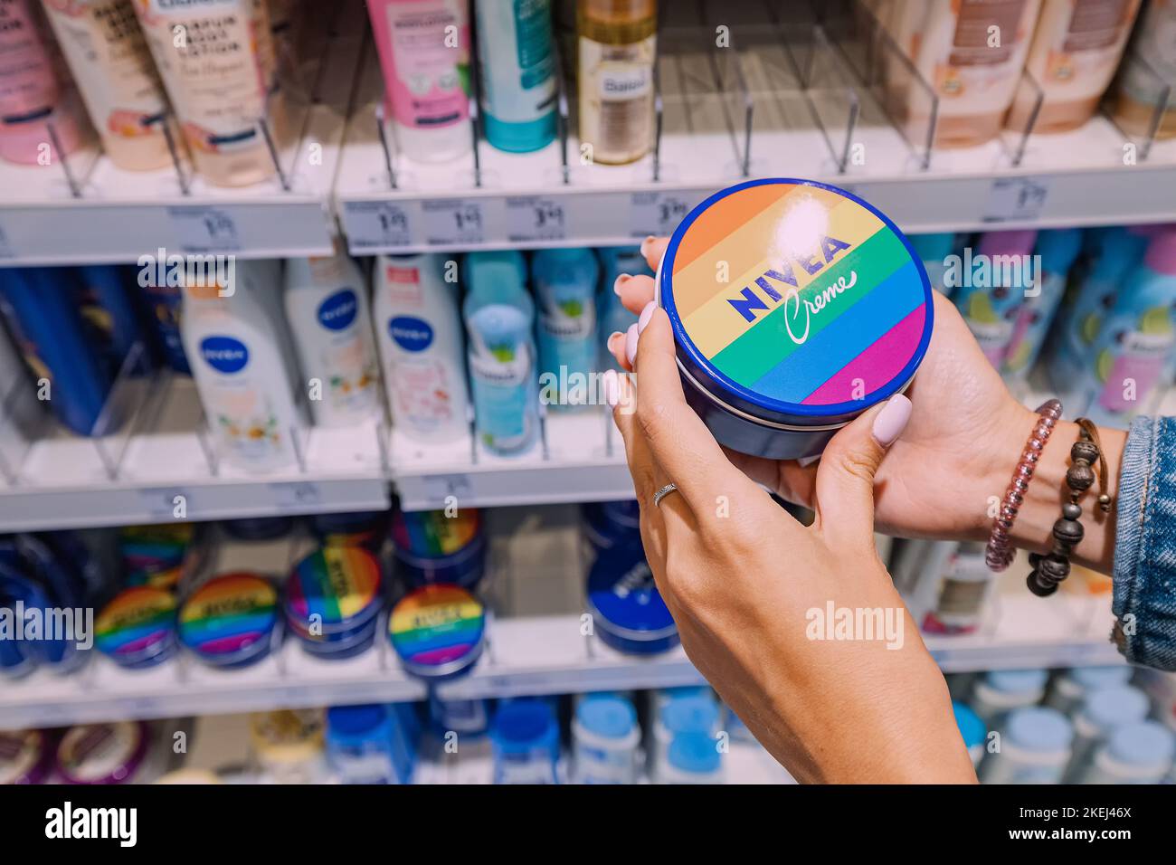 26 July 2022, Munster, Germany: Woman customer choosing Nivea cream ...