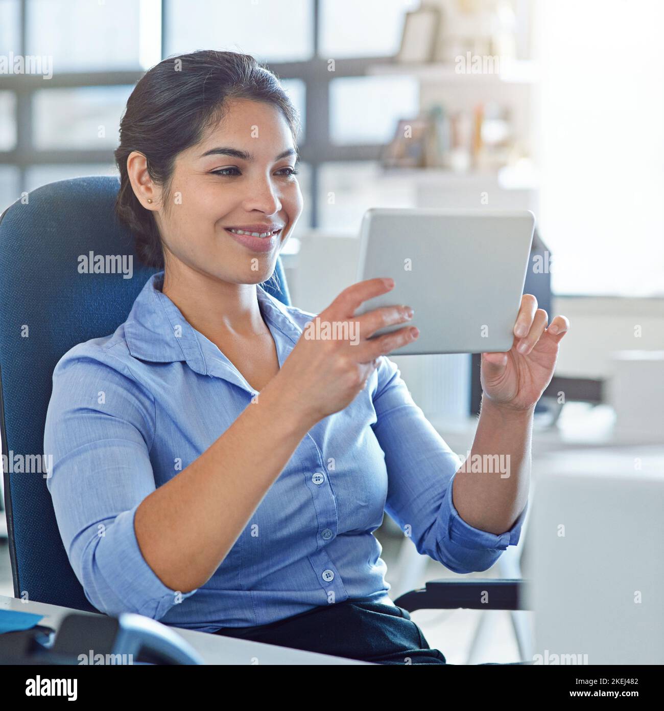 Now thats what I like to see. a young businesswoman using a digital ...