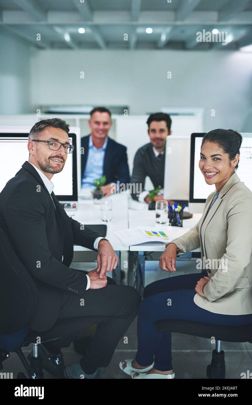 Success is the product of teamwork. corporate colleagues working ...