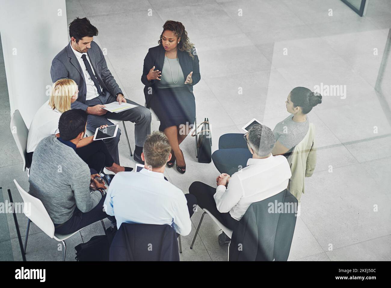 Coworkers talking in a circle hi-res stock photography and images - Alamy
