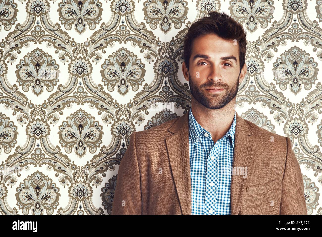 Hes got tons of charm. Portrait of a stylishly dressed young man posing ...