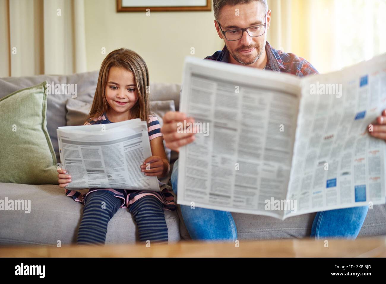 Child Reading Newspaper