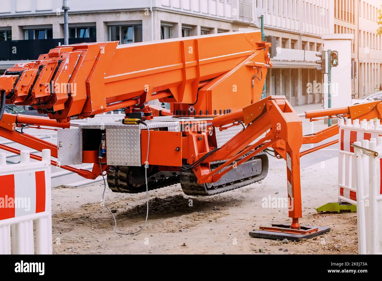 Industrial telescopic unmanned crane standing on hydraulic support legs ...