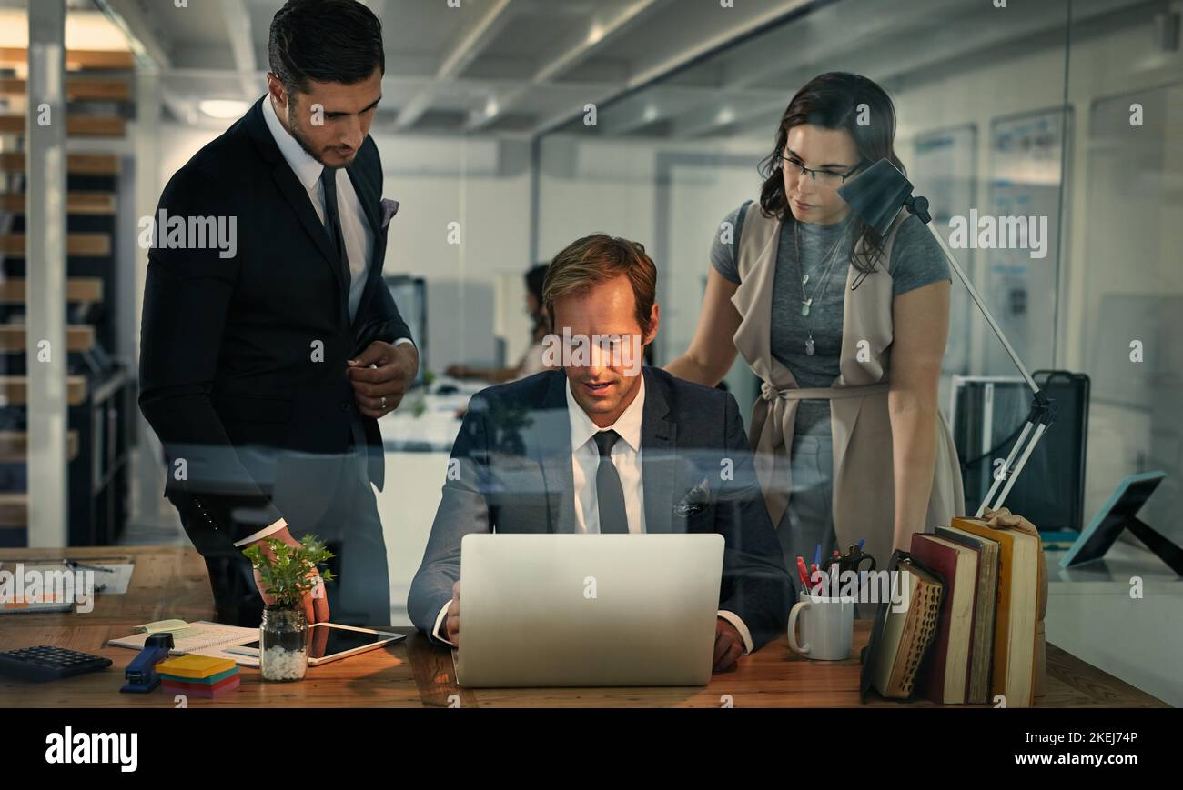 Regrouping as a team to catch up on their project. a team of colleagues ...