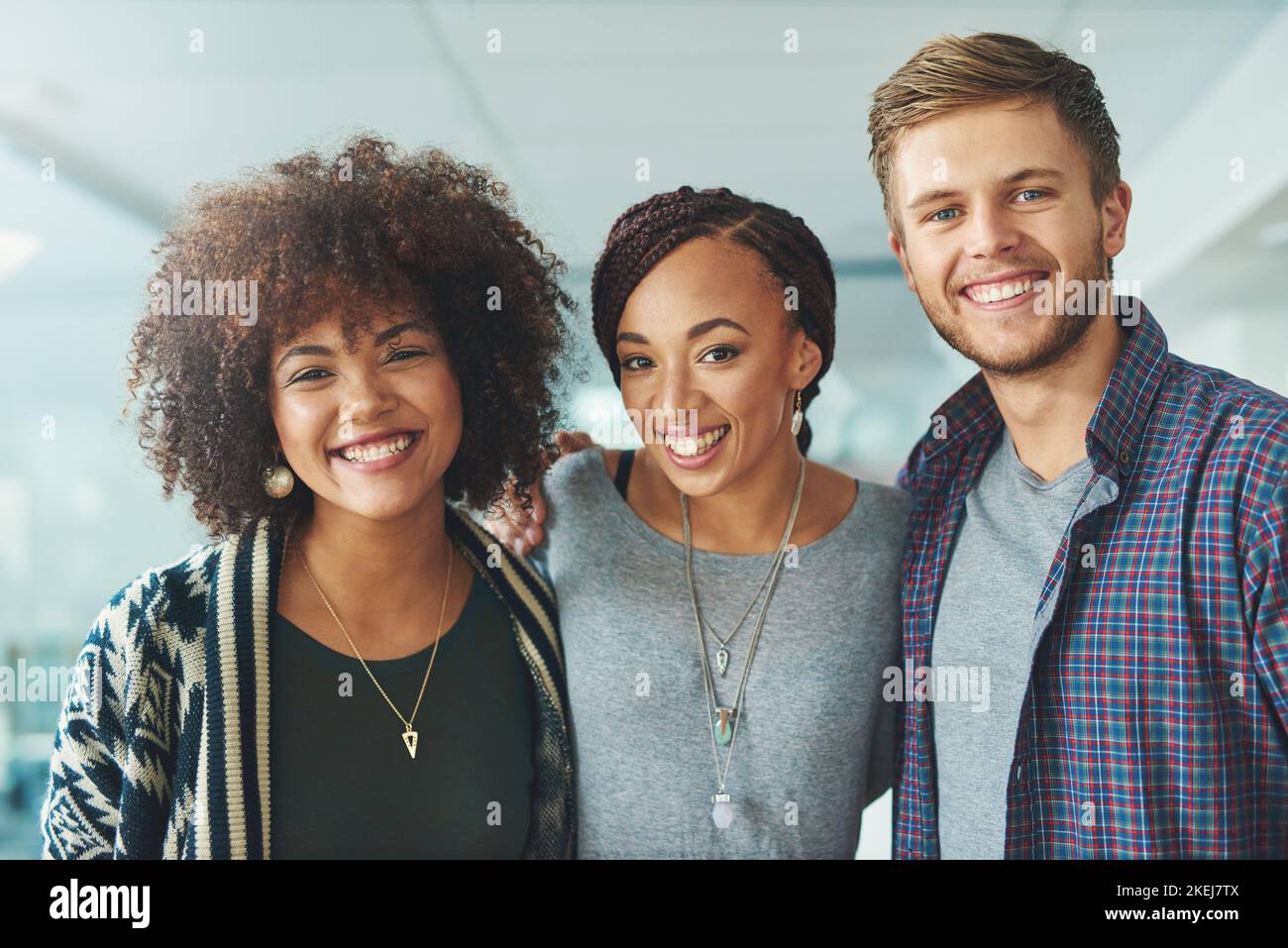 Surrounded by a team of smiling faces. Portrait of a group of happy and ...
