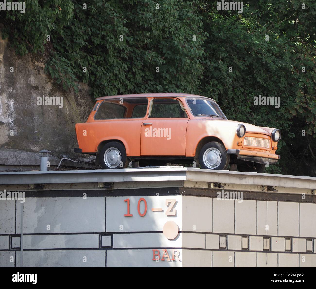 BRNO, CZECH REPUBLIC - CIRCA SEPTEMBER 2022: Orange trabant car on top ...