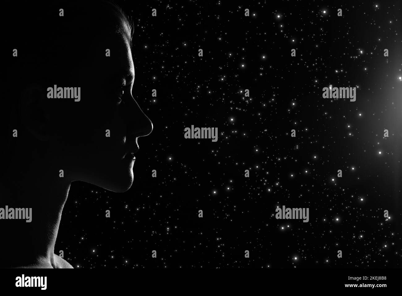 sad female profile silhouette on stars background with copy space ...