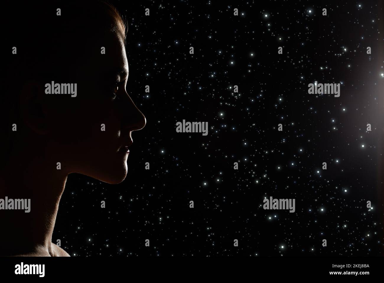 sad female profile silhouette on stars background with copy space ...