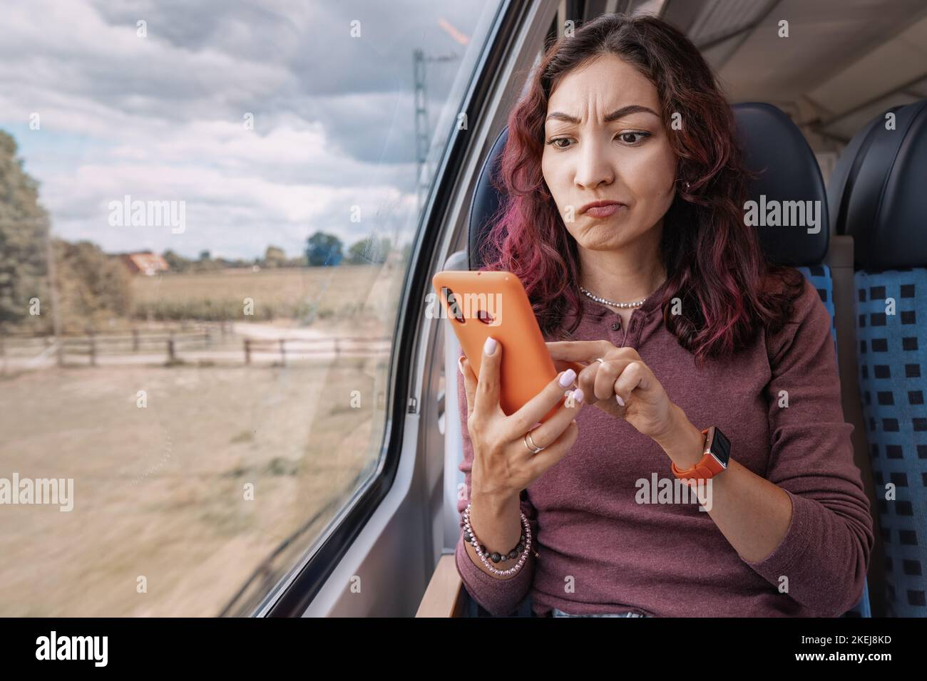 Annoyed girl unsuccessfully tries to catch a cellular signal or an ...