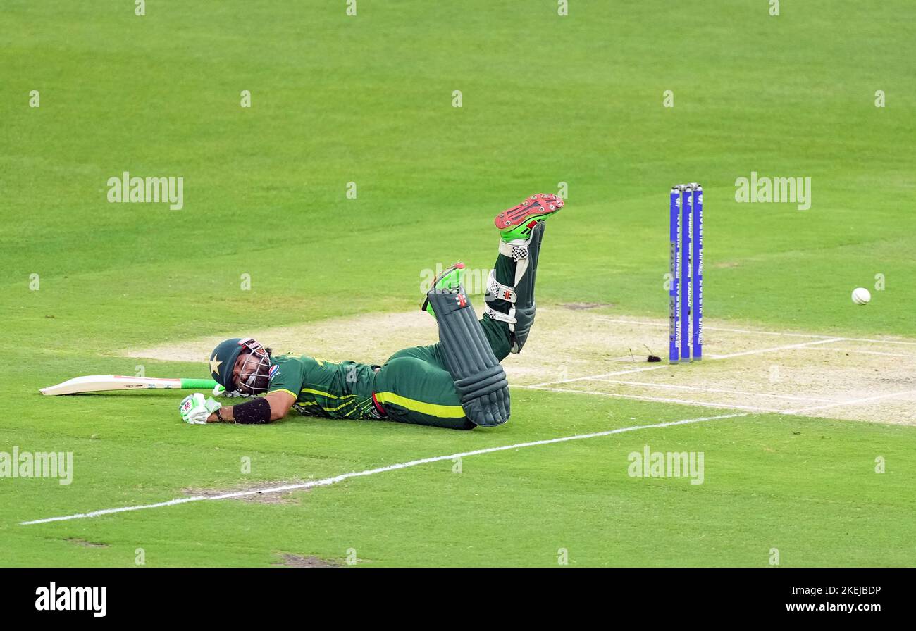 Pakistan's Mohammad Rizwan dives to avoid a run out during the T20 ...
