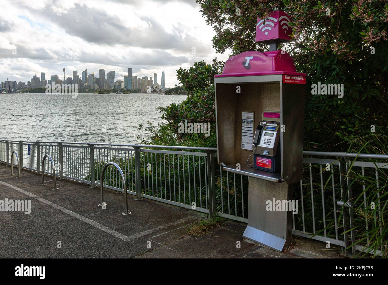 A Telstra payphone with the Sydney skyline in the back Stock Photo - Alamy