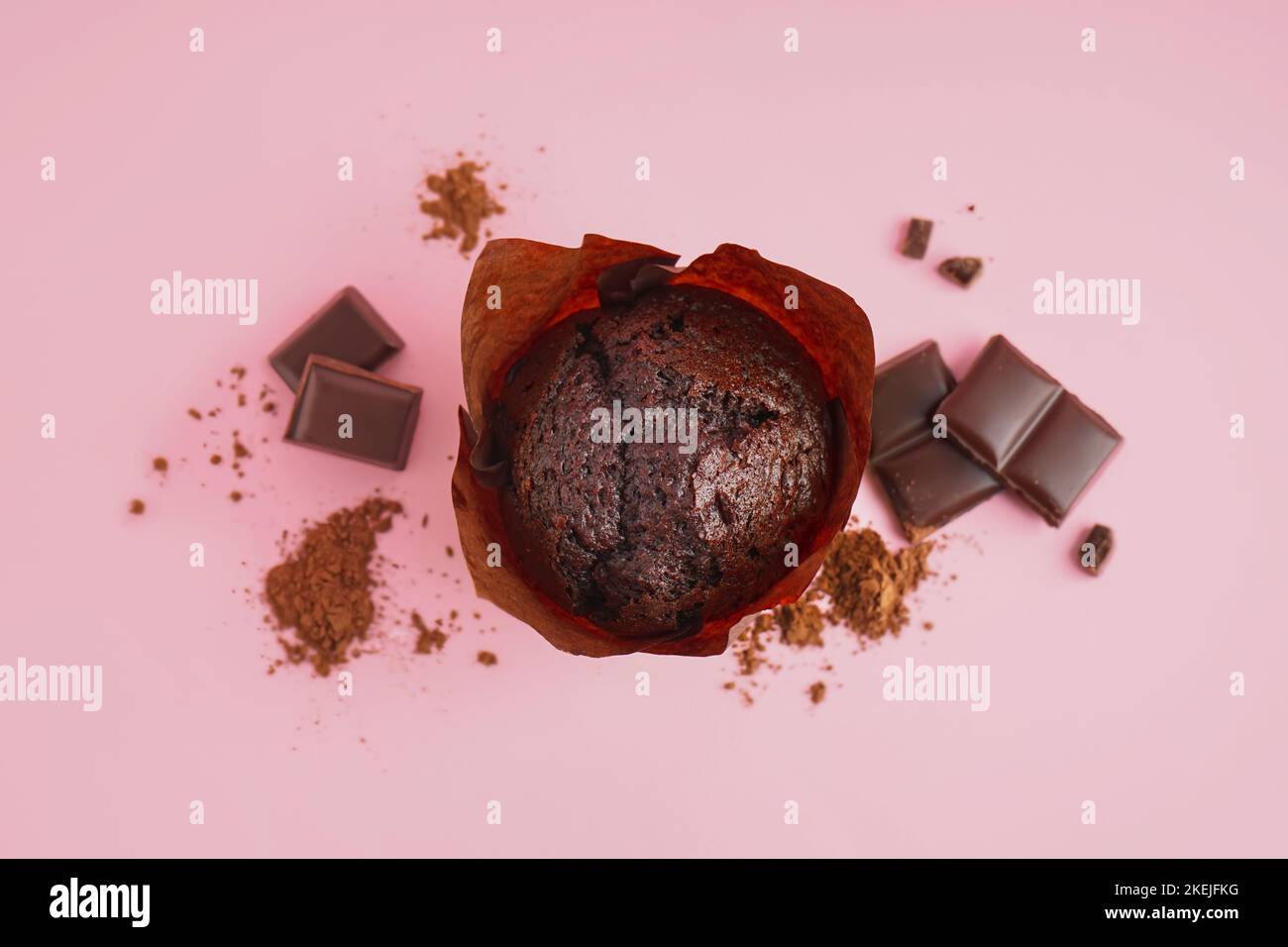 Delicious chocolate muffin on pink background Stock Photo - Alamy