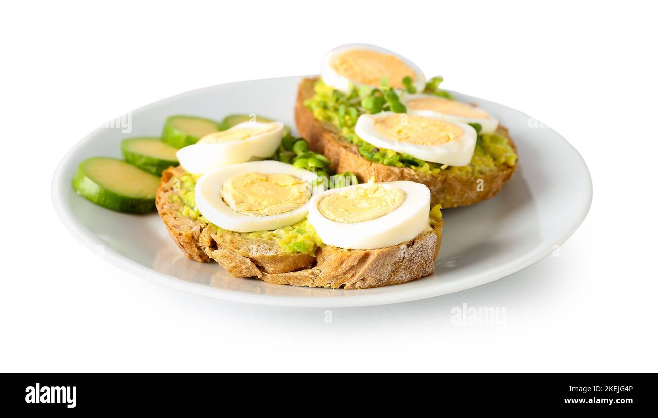 Plate of tasty toasts with boiled egg on white background Stock Photo ...