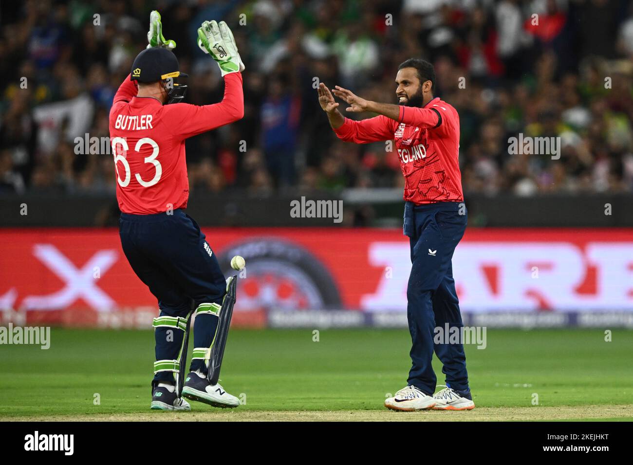 England's Adil Rashid (right) celebrates taking the wicket of Pakistan ...