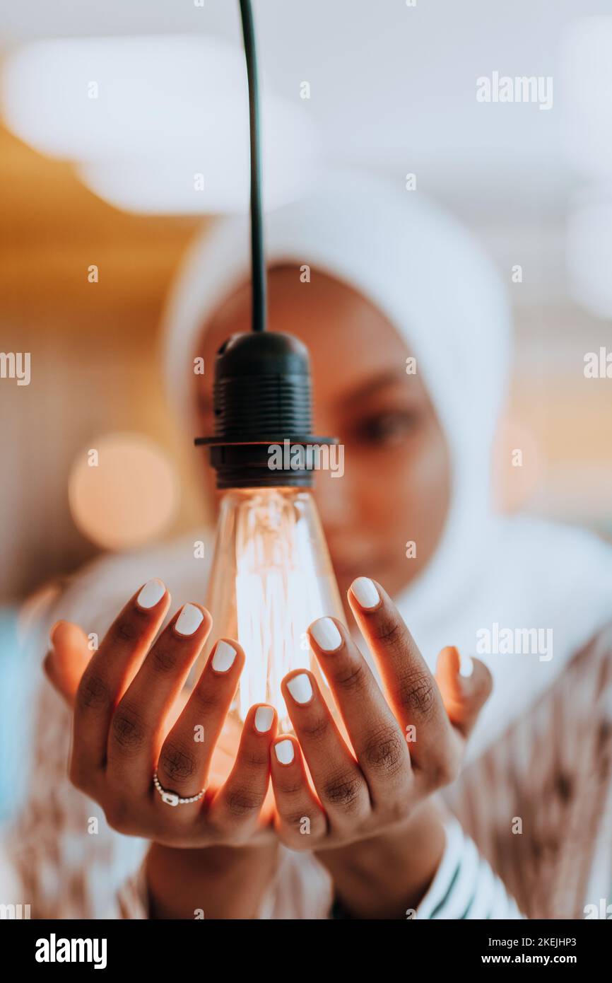 Sentimental portrait of African-American young female Muslim wearing ...