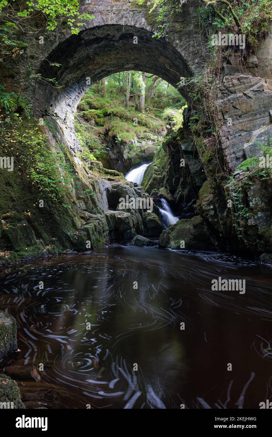 Waterfall and bridge known as "Routin Brig" waterfall on a tributary of ...