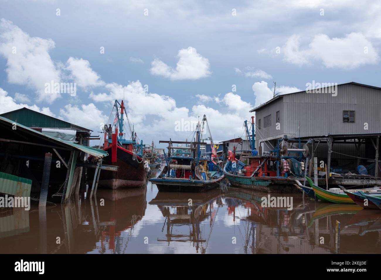 scene of fishing boats harbor at the dock Stock Photo - Alamy