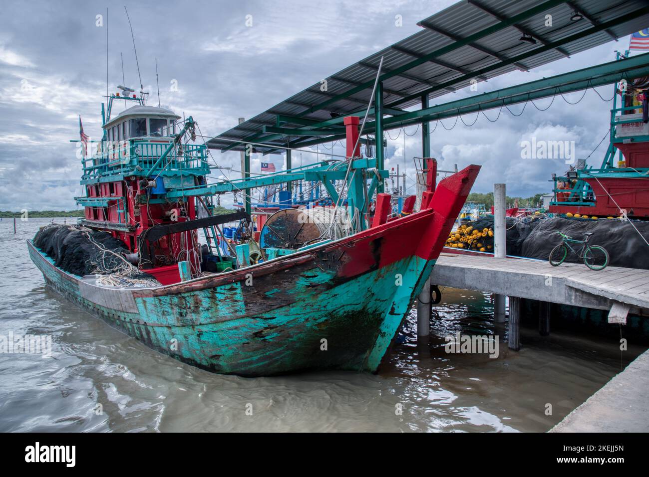 scene of fishing boats harbor at the dock Stock Photo - Alamy