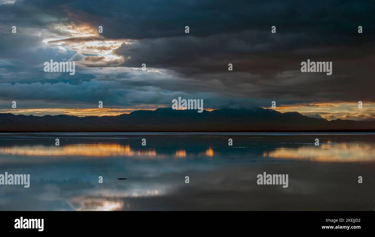 A dark clouds in the sky over the ocean during sunset Stock Photo - Alamy