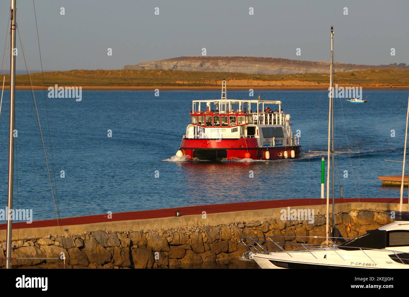 The Naviera Los Reginas ferry approaching the ferry stop with the Somo ...