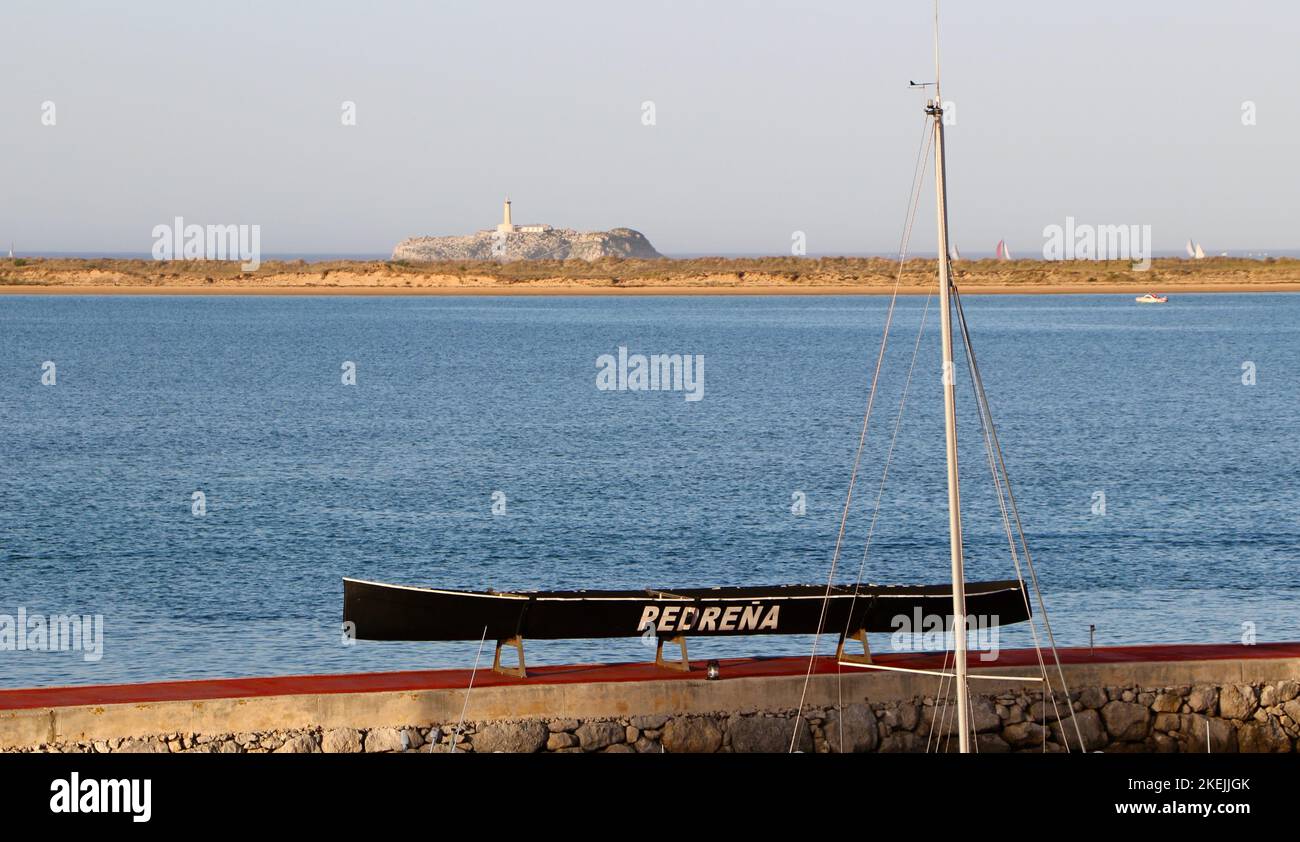 Traditional Trainera rowing boat on display on the edge of the marina ...