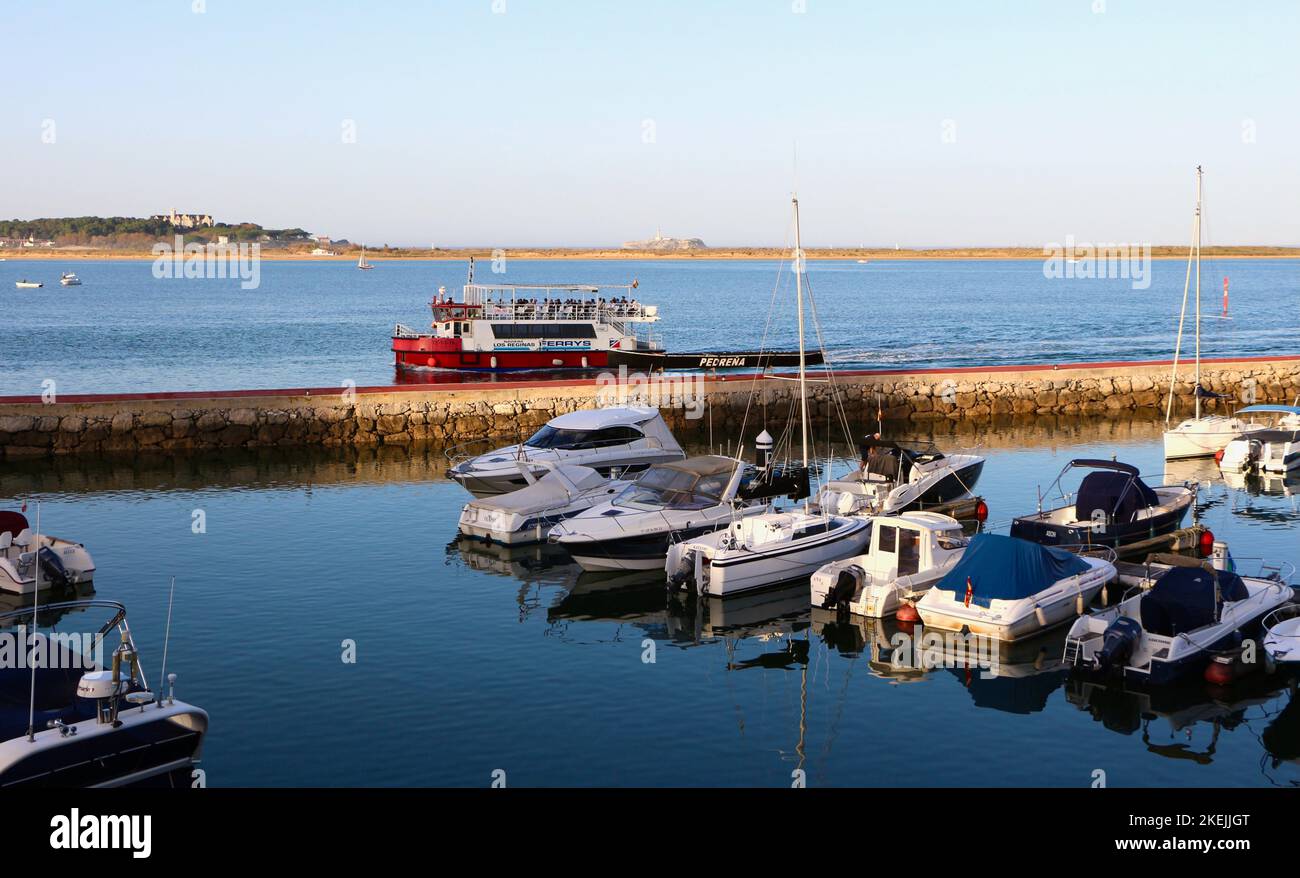 The Naviera Los Reginas ferry approaching the ferry stop with the ...