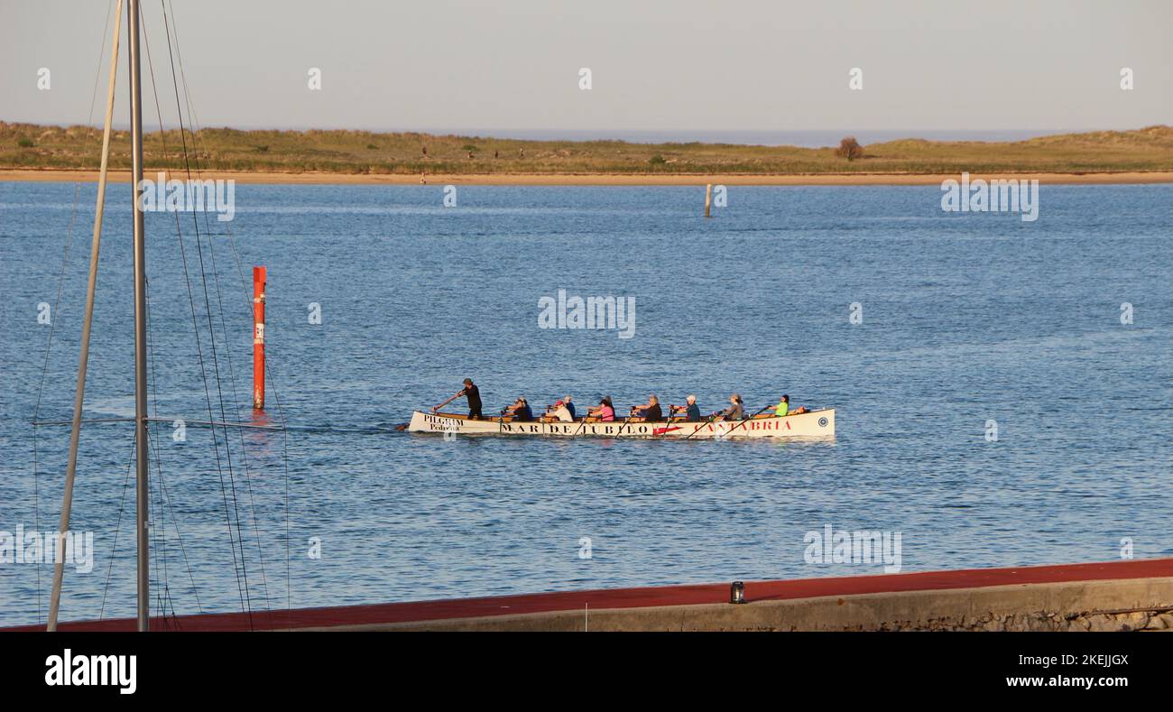 People rowing a traditional Trainera boat in the bay of Santander ...