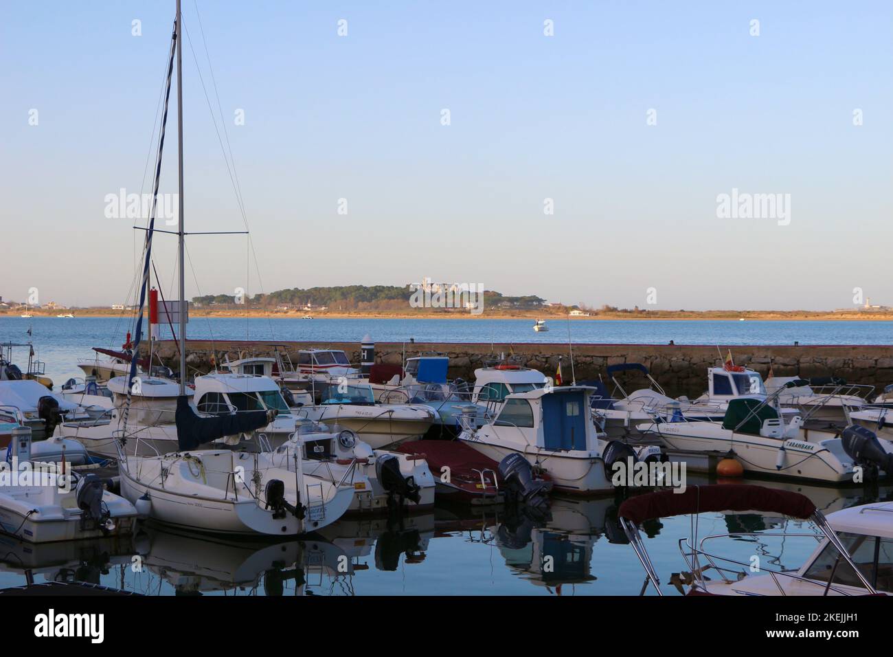 Moored boats in the marina with the Magdalena Palace in the distance ...