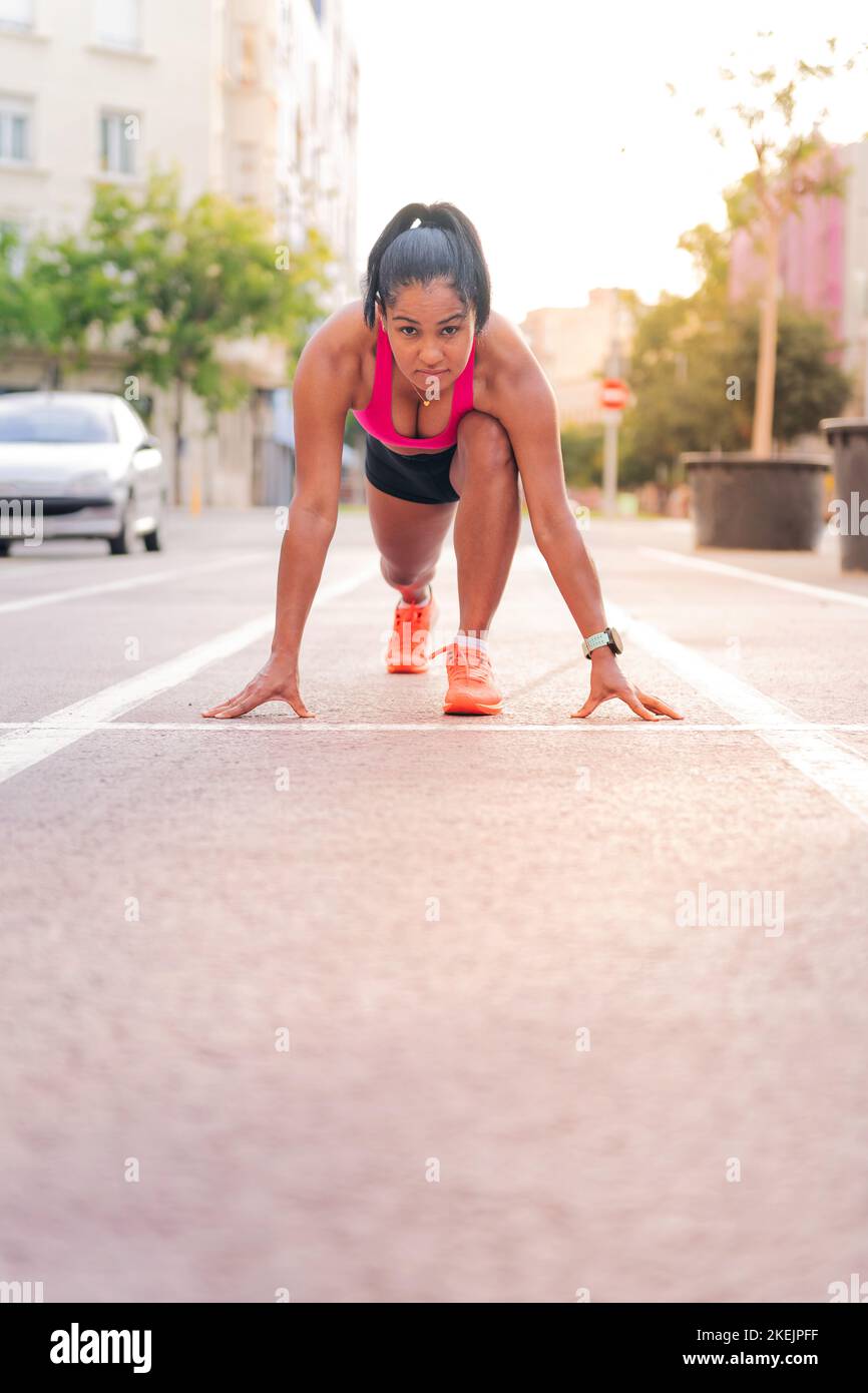 athlete at starting line of the athletics track Stock Photo - Alamy