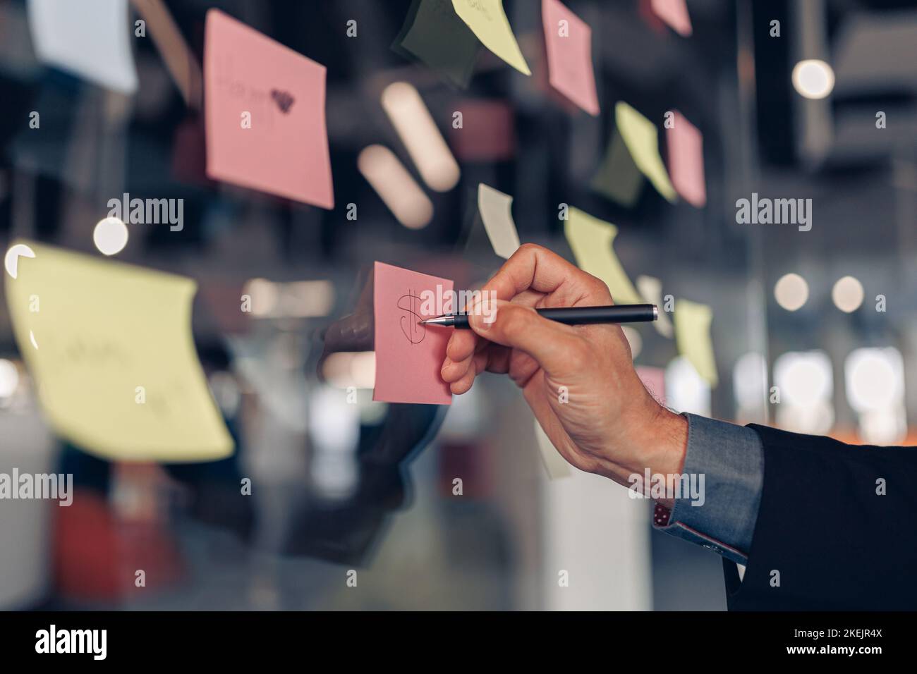 Businessman sticking adhesive notes hi-res stock photography and images ...