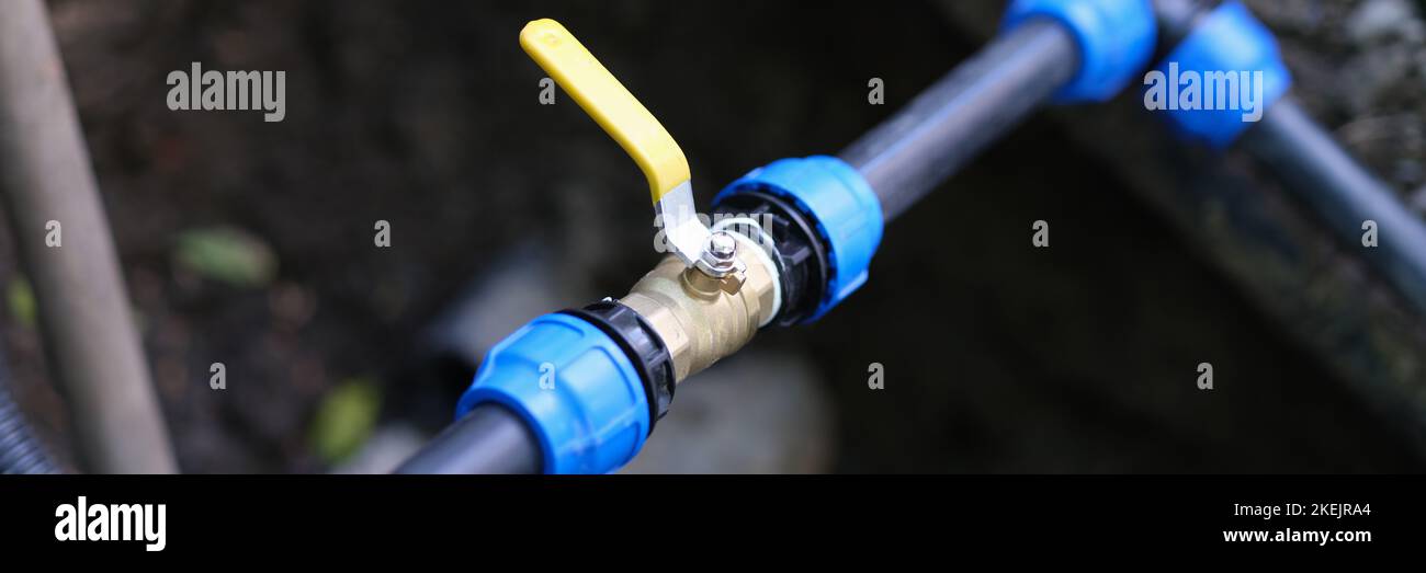 Water valve connected to PVC pipe closeup Stock Photo - Alamy