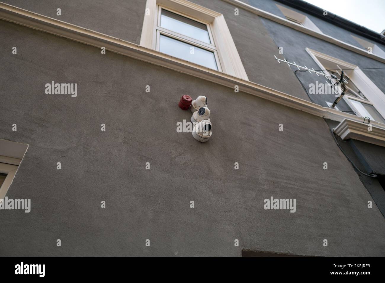Multi-angle CCTV cameras on the wall Stock Photo - Alamy
