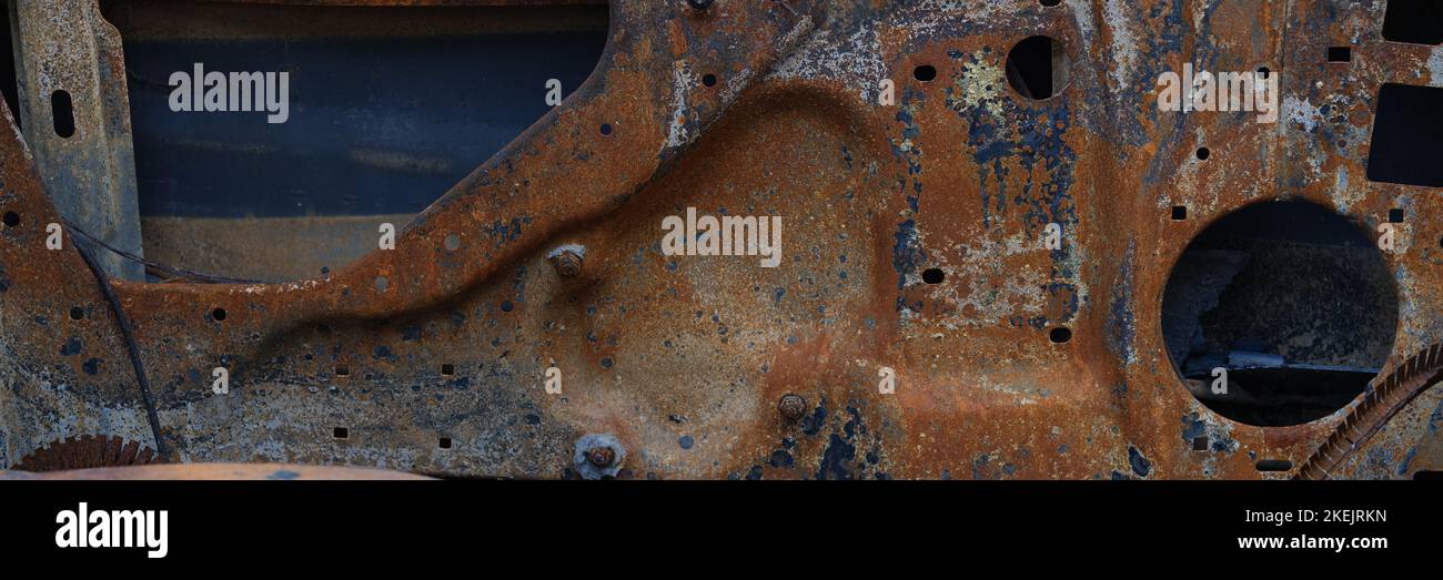 Burnt old rusty car parts. Looting, arson and terrorism Stock Photo - Alamy