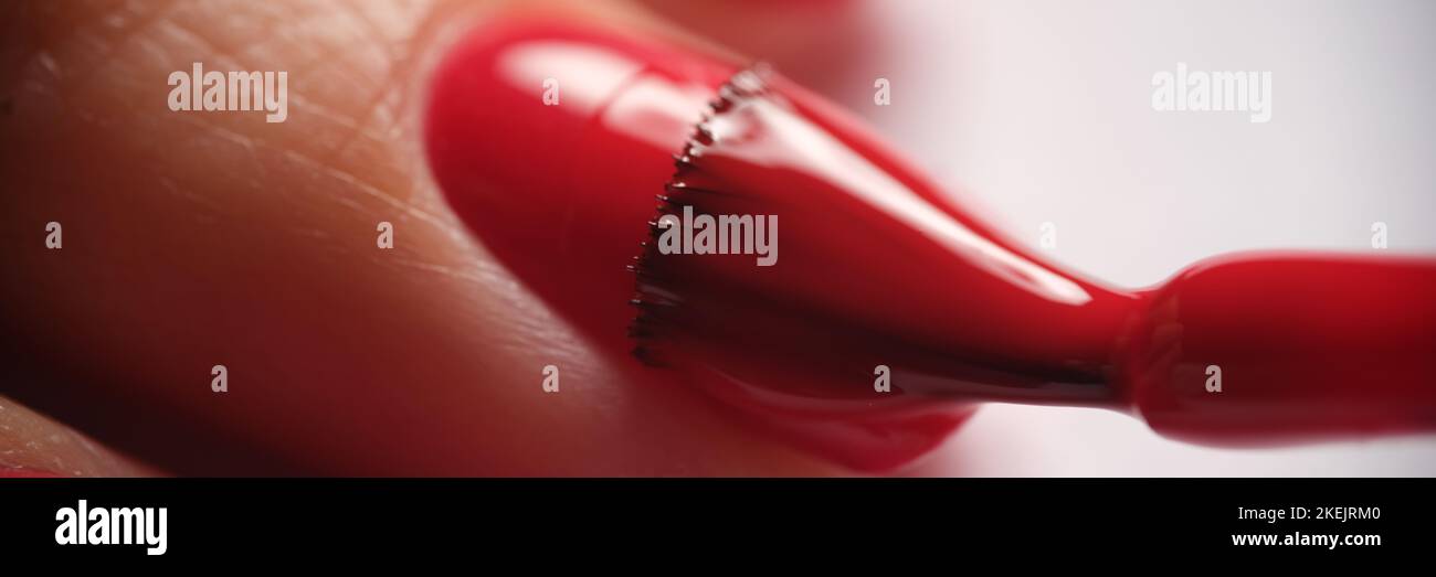 Woman applying pink nail polish hi-res stock photography and images - Alamy