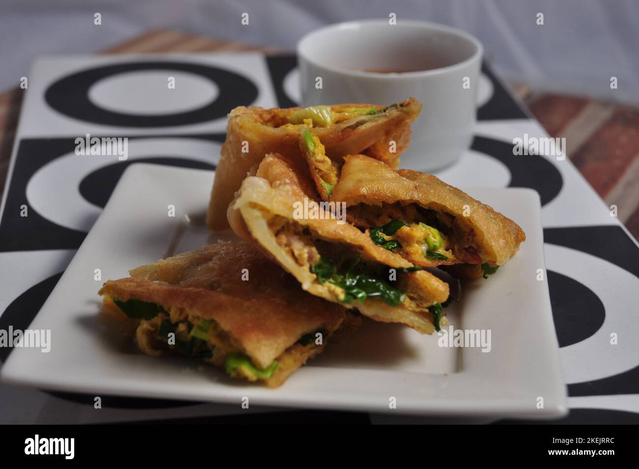 Martabak Telor or Martabak Telur. Savory pan-fried pastry stuffed with ...