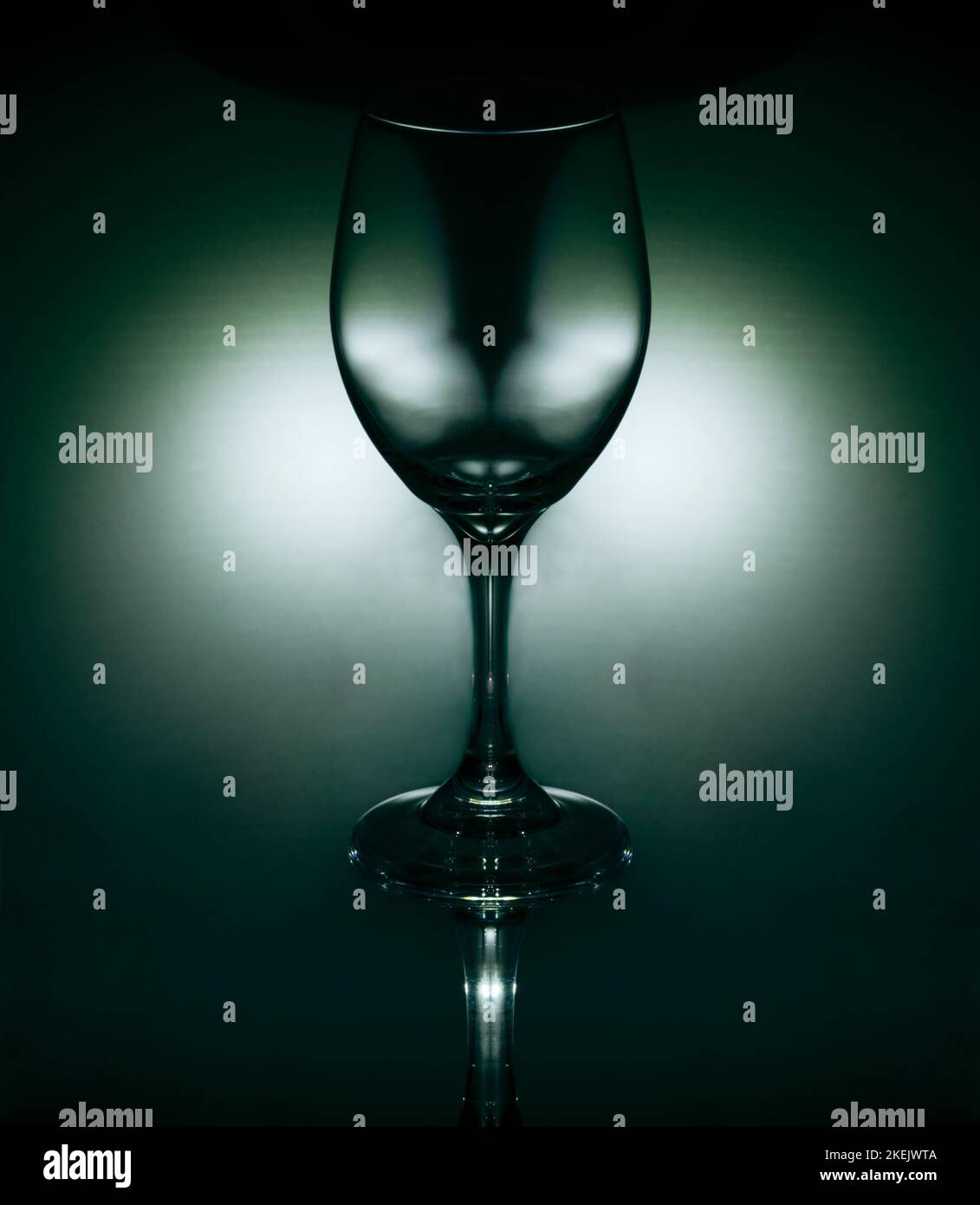 A hurricane shadow in a wine glass on a dark background Stock Photo - Alamy