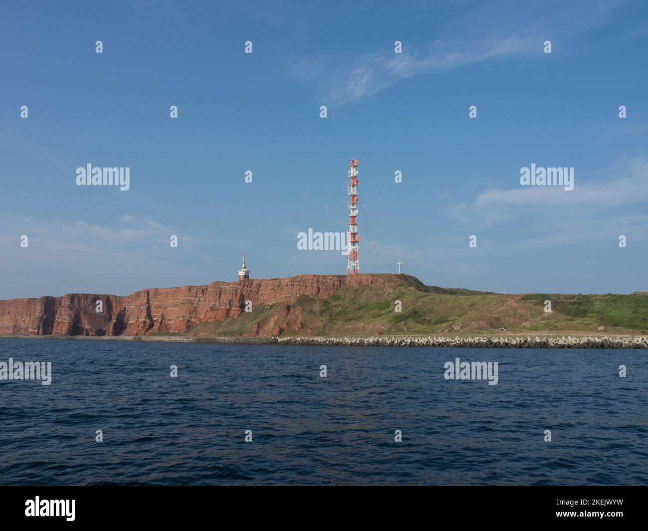 The radio tower over the land next to the sea in Helgoland island ...