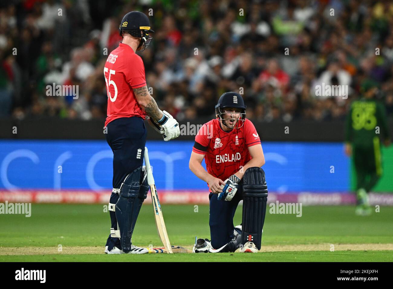 England's Harry Brook of England (right) reacts after being struck in ...