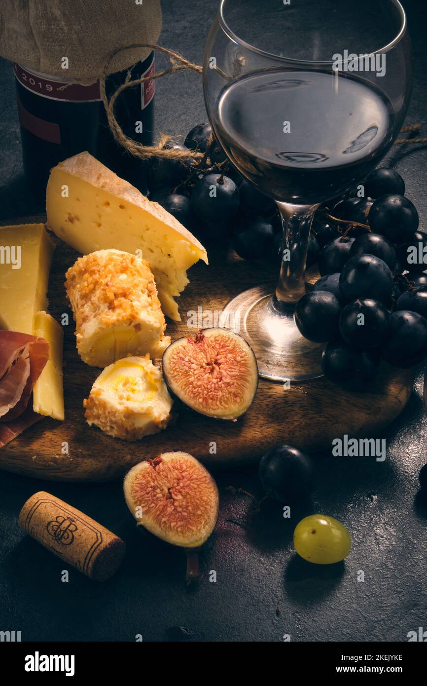 still life wine different cheeses and fruits Stock Photo - Alamy