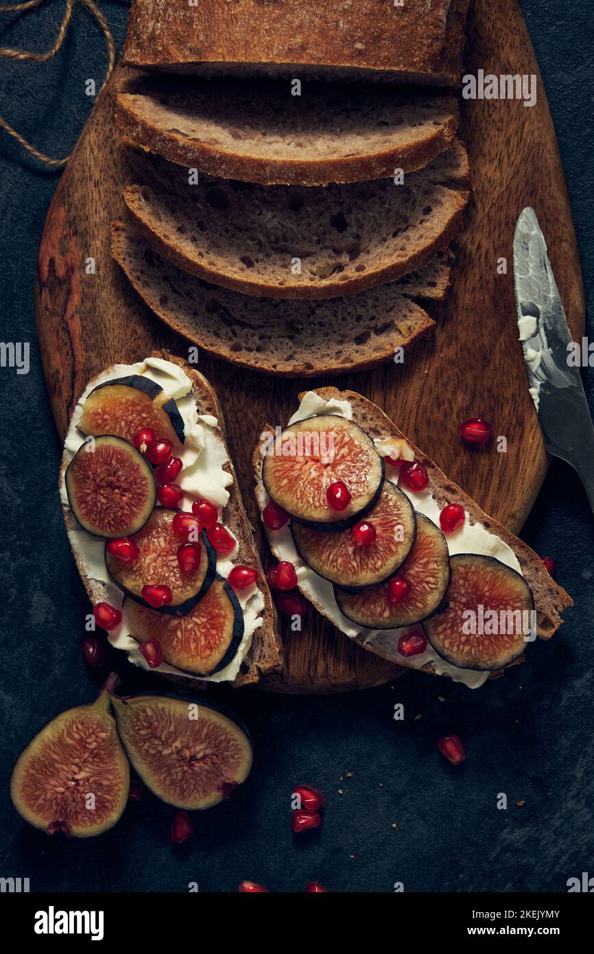 slices of rye bread with figs and pomegranate Stock Photo - Alamy
