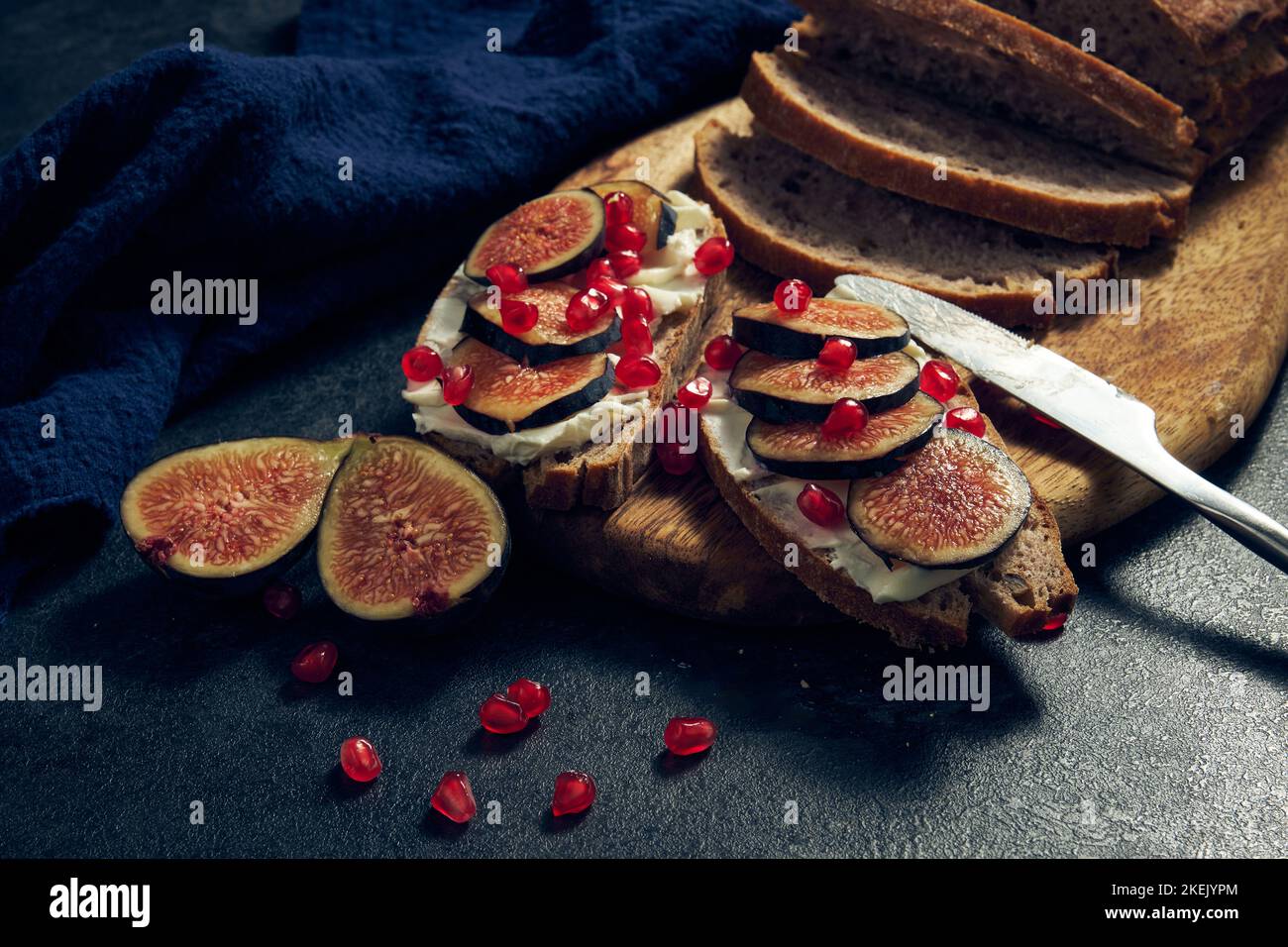 slices of rye bread with figs and pomegranate Stock Photo - Alamy