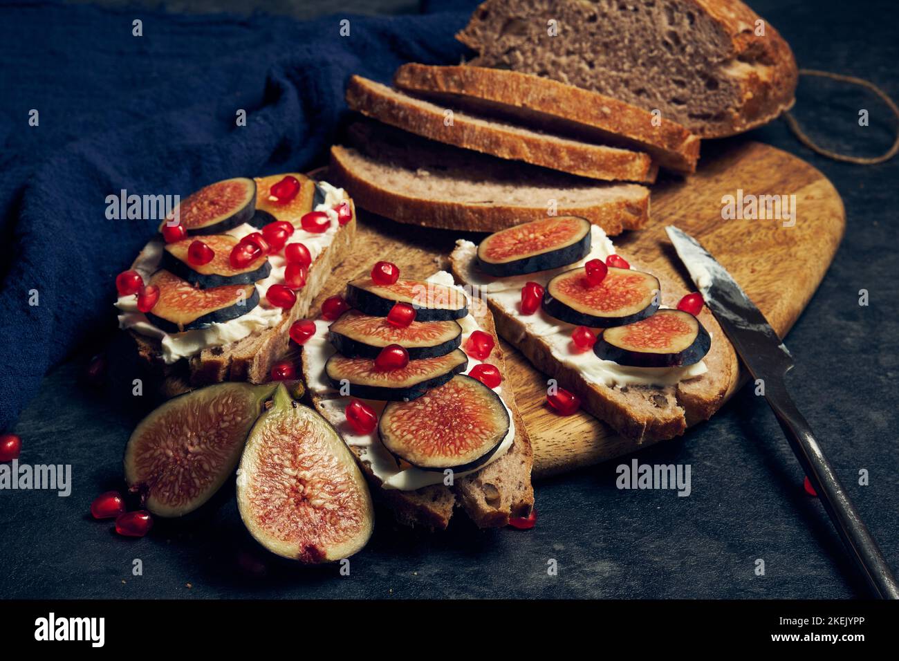 slices of rye bread with figs and pomegranate Stock Photo - Alamy